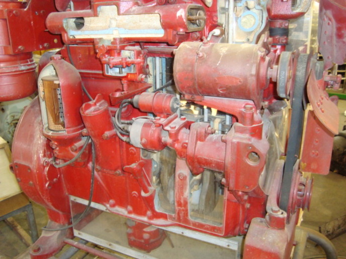 Auction with cutaway gas start engine - IH Construction Equipment - Red ...